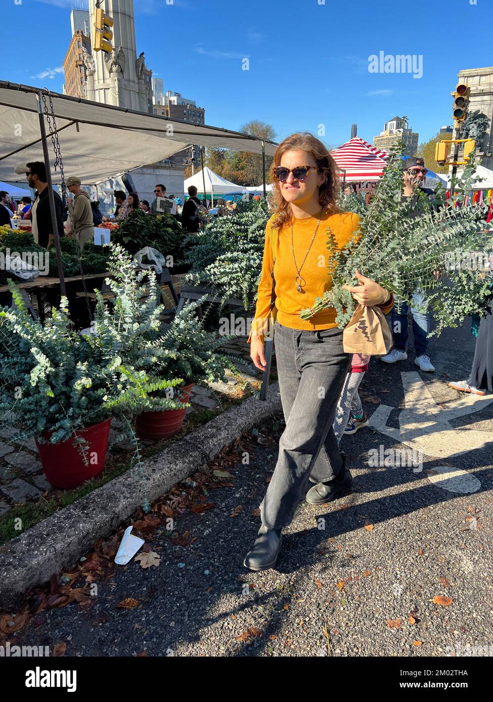 Woman with a bunch of Eucalyptus branches at the Grand Arm Plaza ...