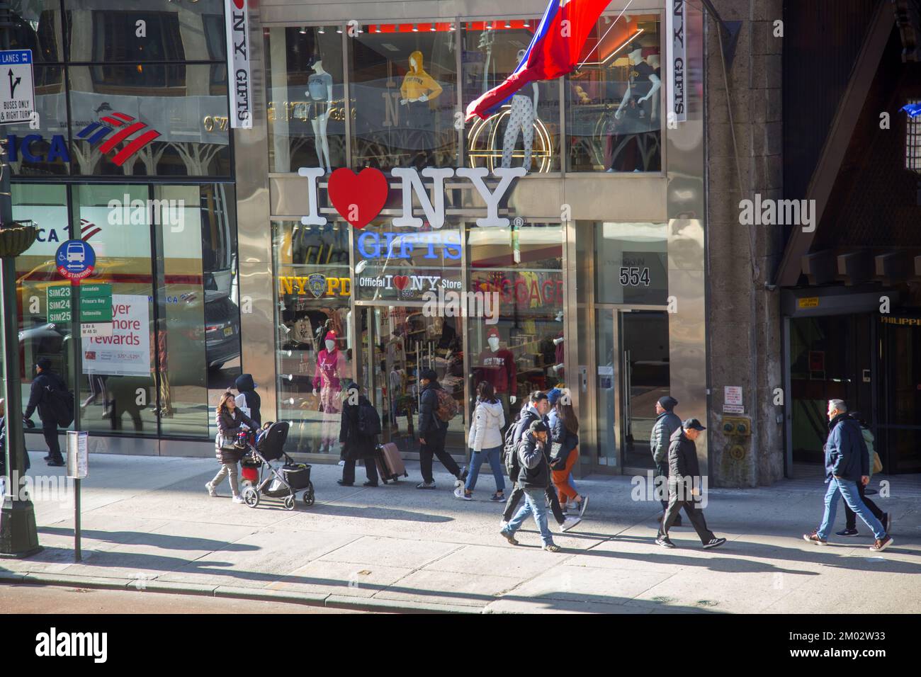 People walk by an I Love New York clothing and souvenir shop on 5th ...