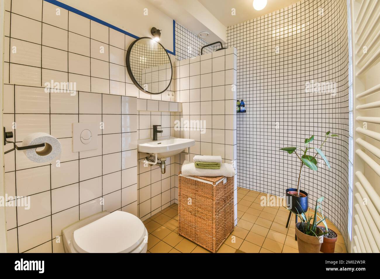 Tile partition between shower tap and wall hung toilet in modern ...