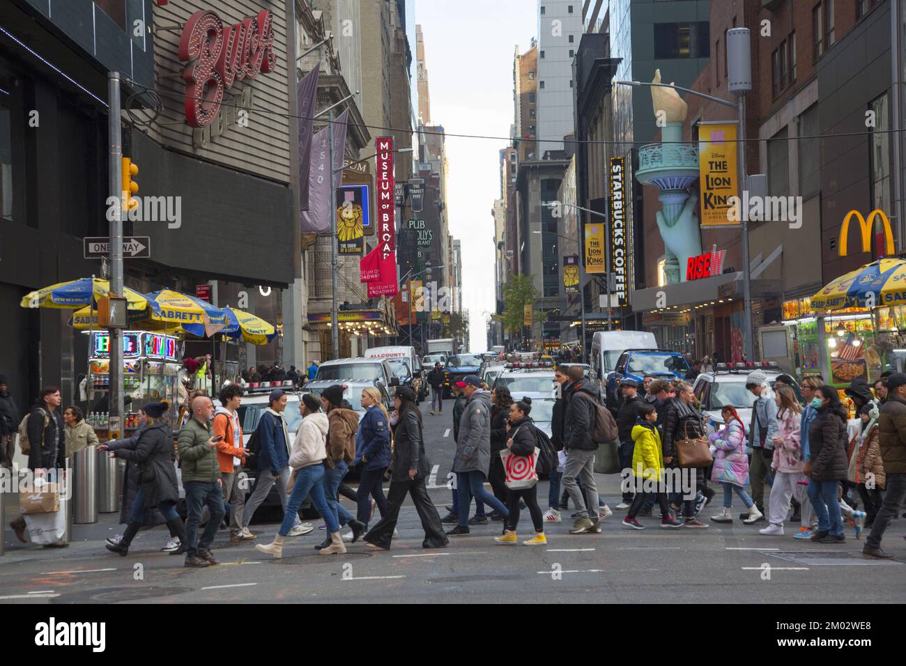 Crowds of people walk up Broadway across 45th Street in Times Square ...