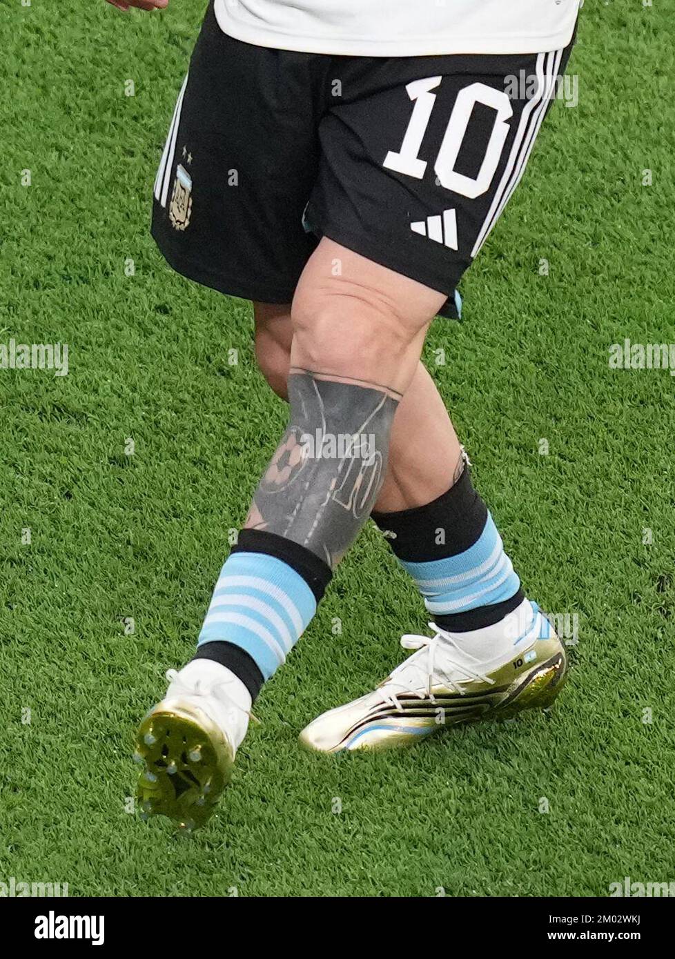 A tattoo on the leg of Argentina's Lionel Messi whilst warming-up ...