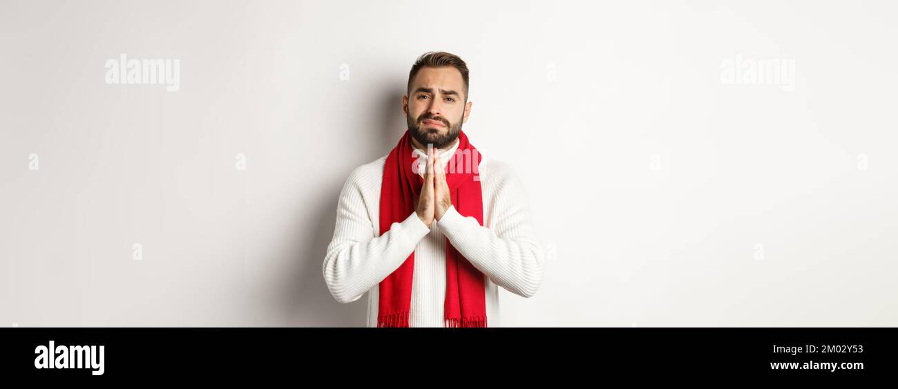 Christmas holidays and New Year concept. Desperate man begging for help ...