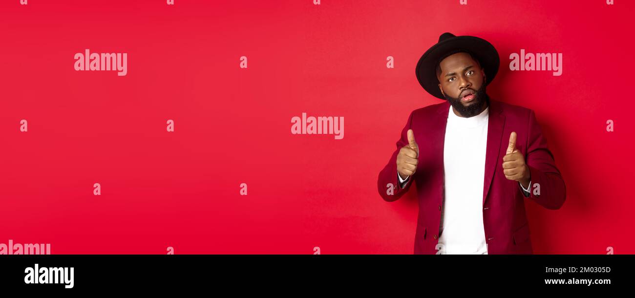 Impressed Black man saying good job, cheer up with thumbs-up, praise ...