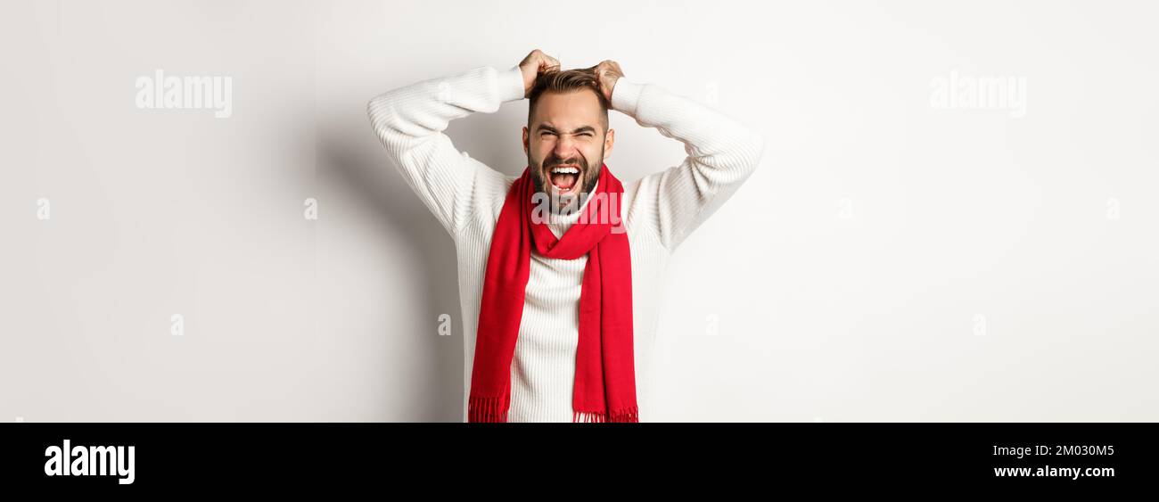 Christmas holidays and New Year concept. Frustrated and angry man ...