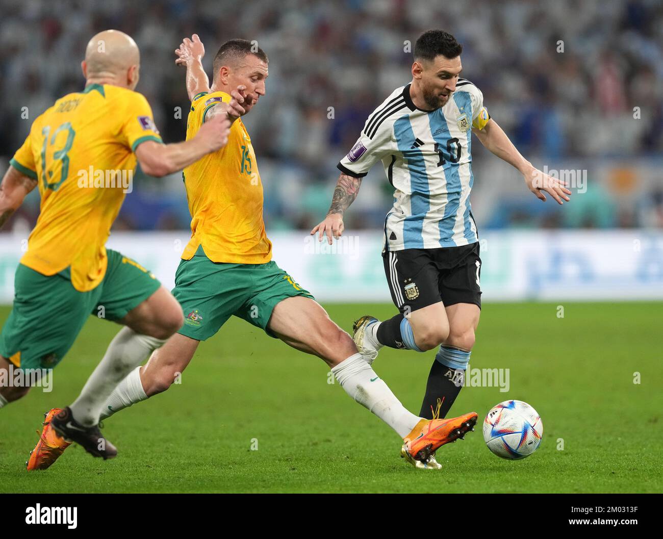 Australia's Mitchell Duke (left) and Argentina's Lionel Messi battle ...