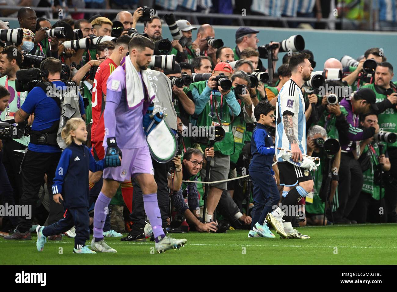 Al Rayyan, Qatar. 3rd Dec, 2022. Lionel Messi (R) of Argentina enters ...