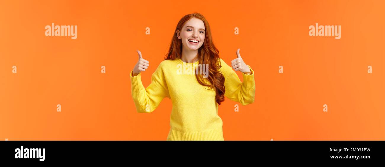 Holidays, gestures, people concept. Cheerful cute redhead girl smiling ...