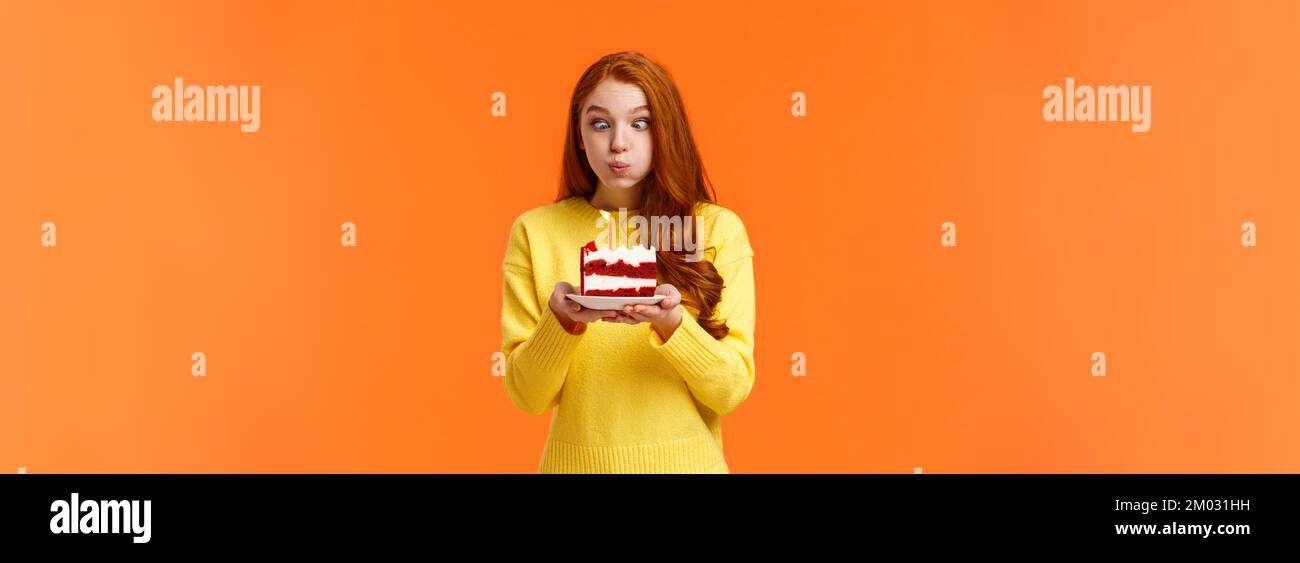 Funny and silly cute redhead b-day girl squinting eyes making goofy ...