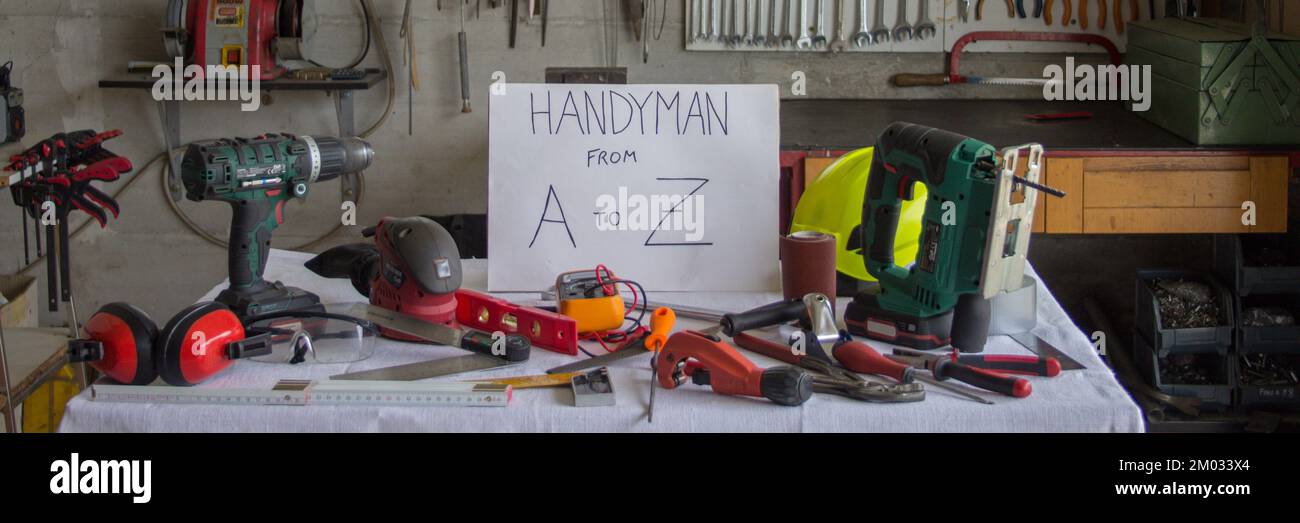 Image of a workshop with a workbench with work tools and a Handyman ...