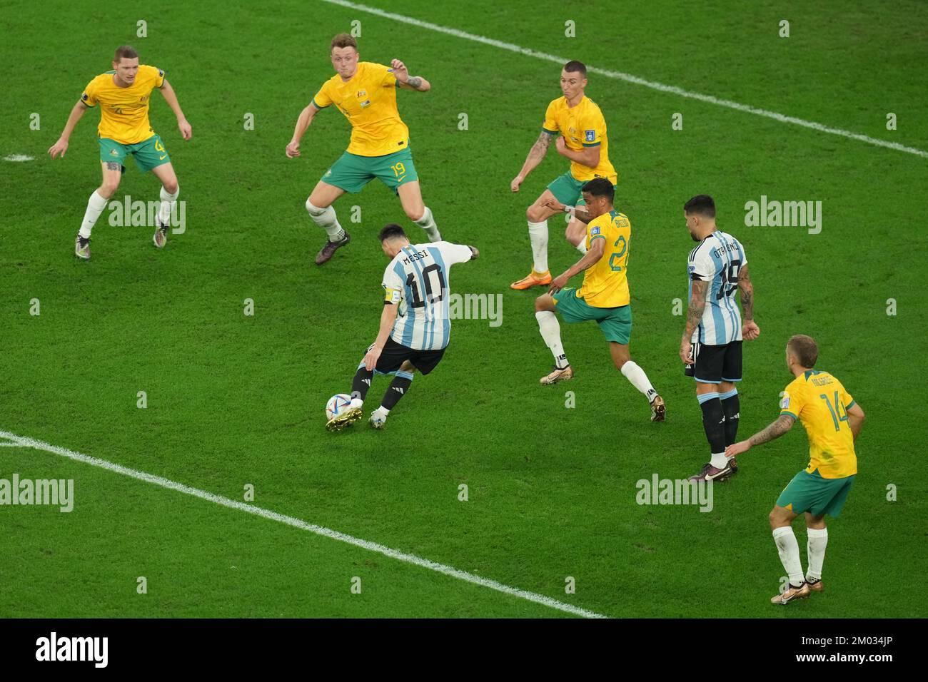 Argentina's Lionel Messi (centre) scores their side's first goal of the ...
