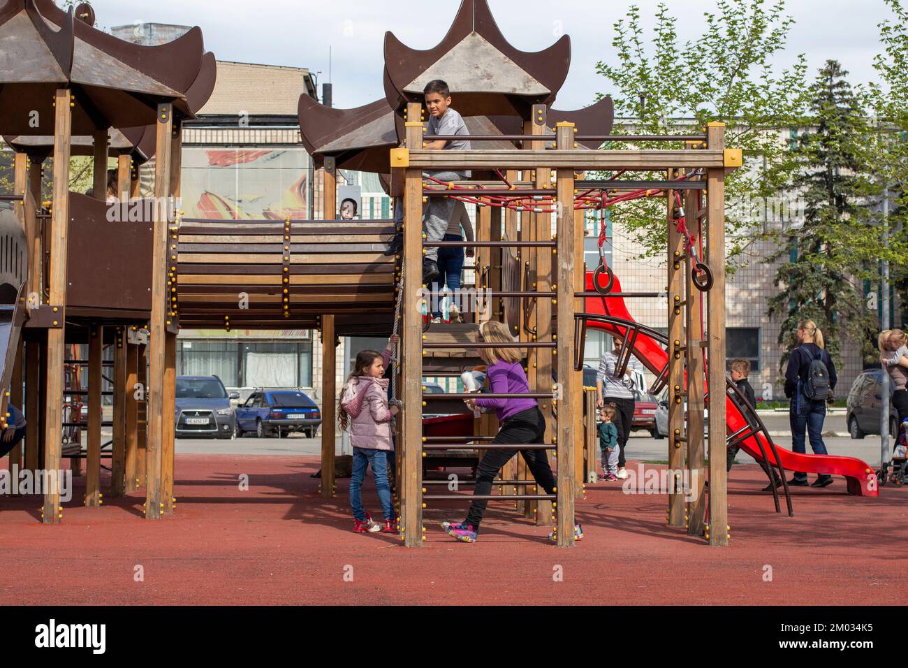 Children playing in playground Stock Photo - Alamy