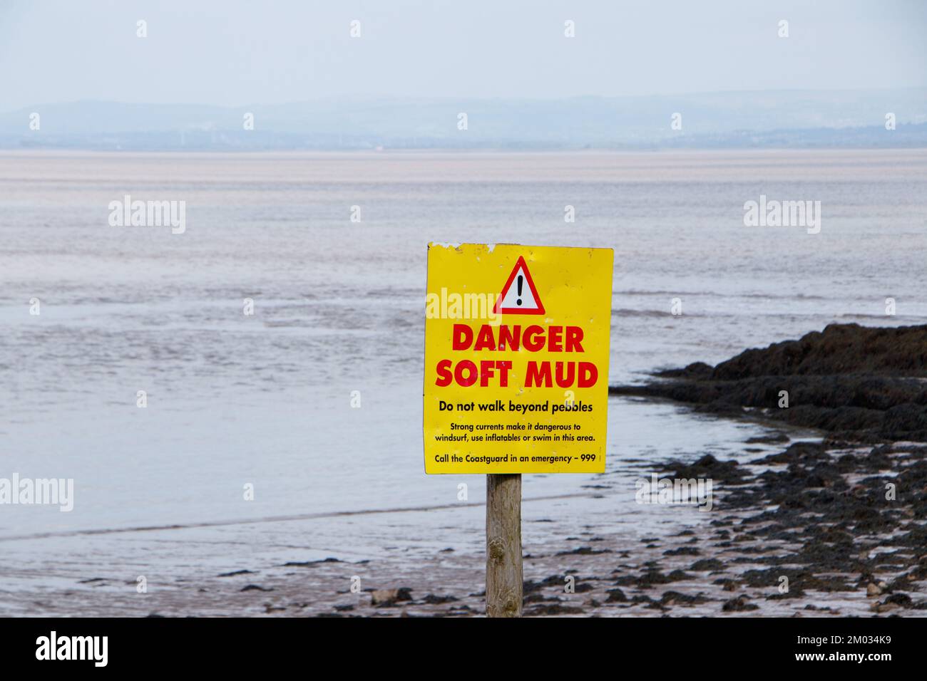 Danger soft mud warning sign on coast at Stock Photo - Alamy