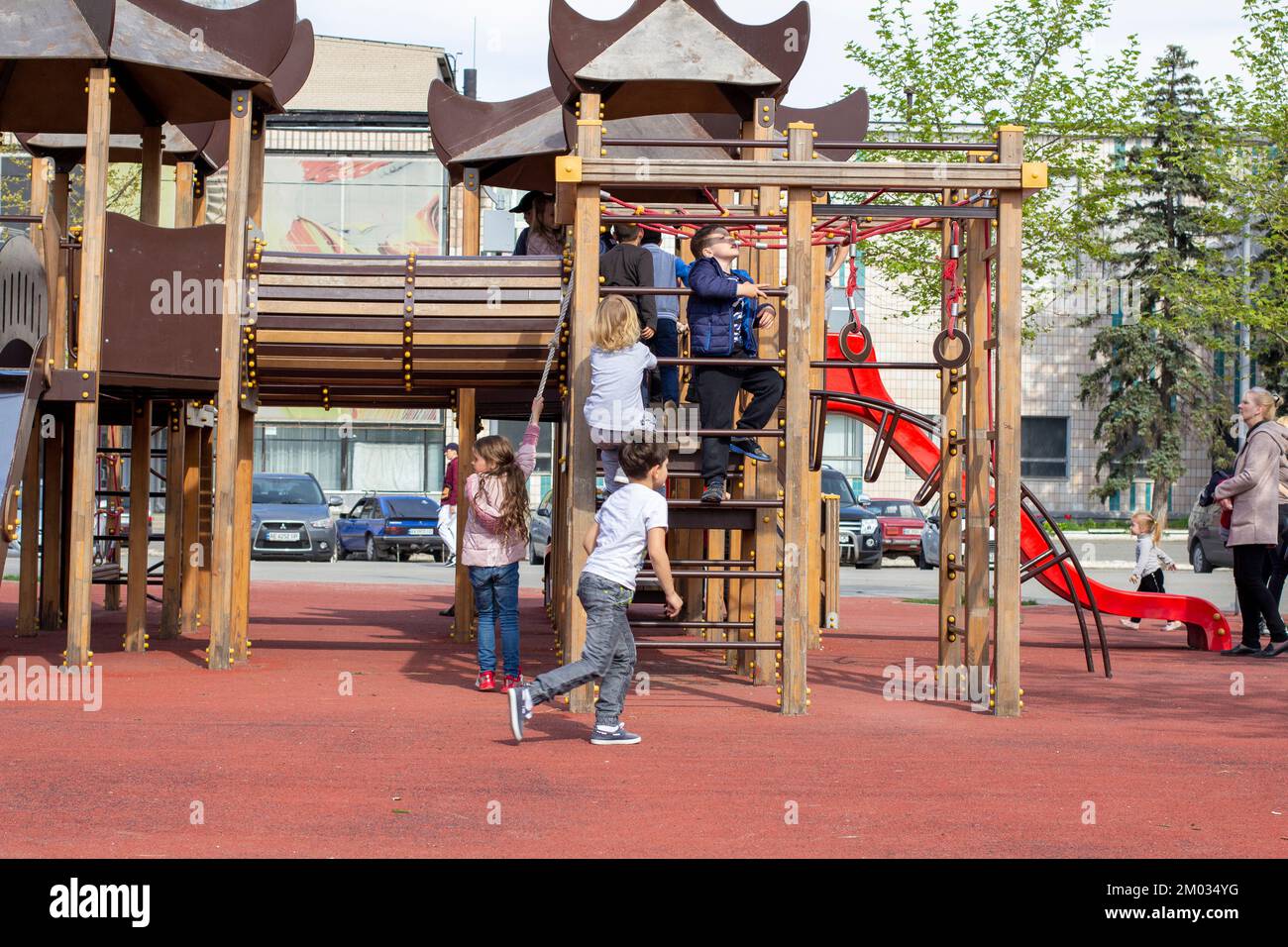 Children playing in playground Stock Photo - Alamy