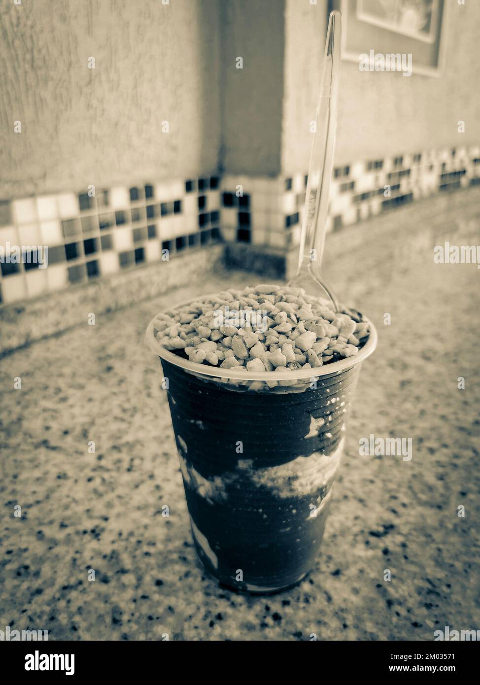 Brazilian superfood berry açaí in a mug as ice and peanuts. Açaí King ...