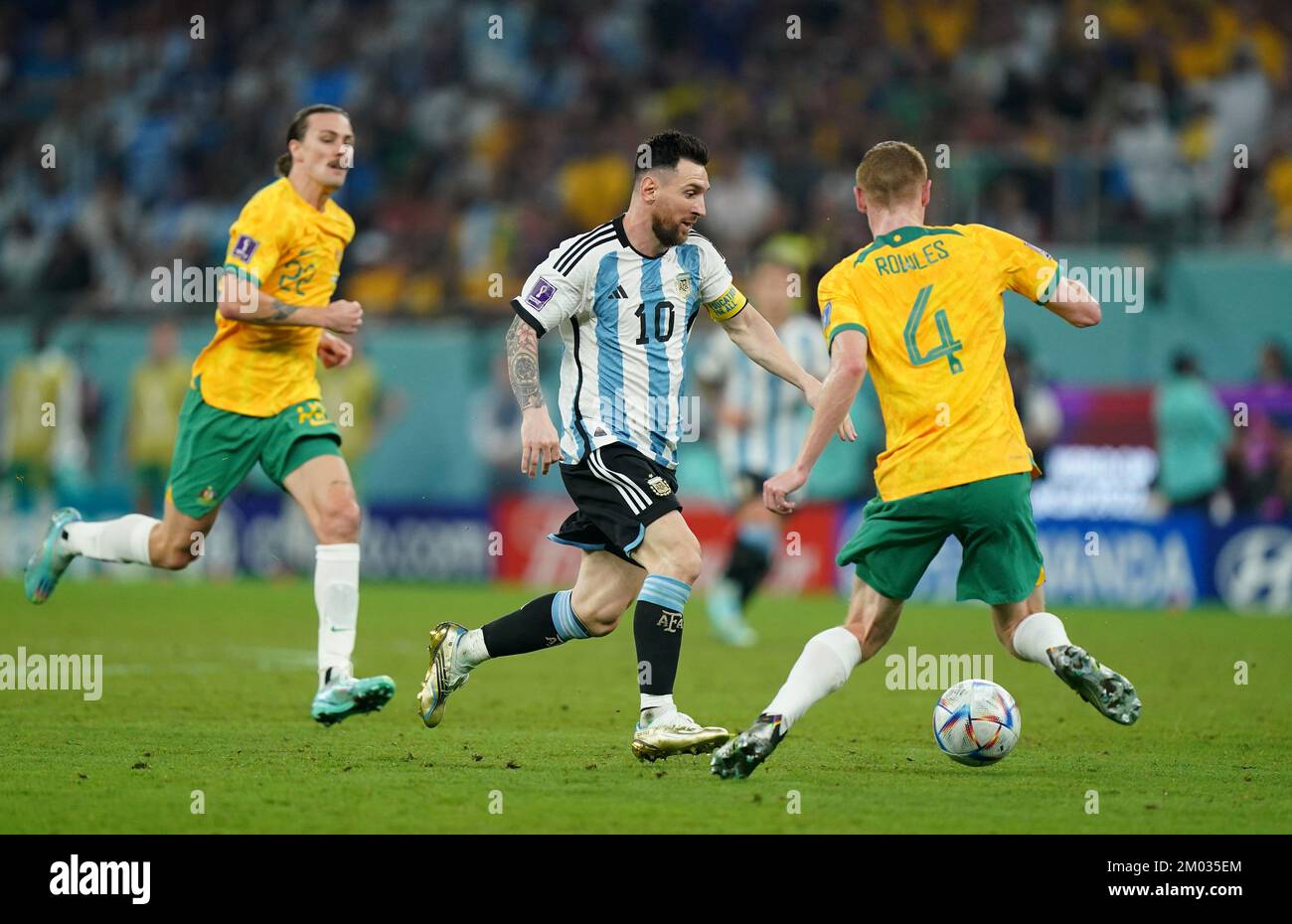 Argentina's Lionel Messi (centre) and Australia's Kye Rowles battle for ...