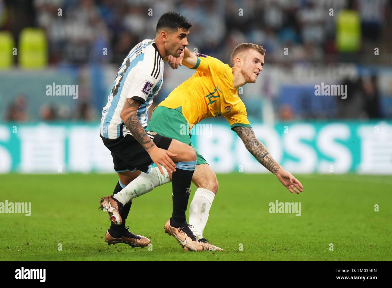 Cristian Romero of Argentina and Riley McGree of Australia during the ...