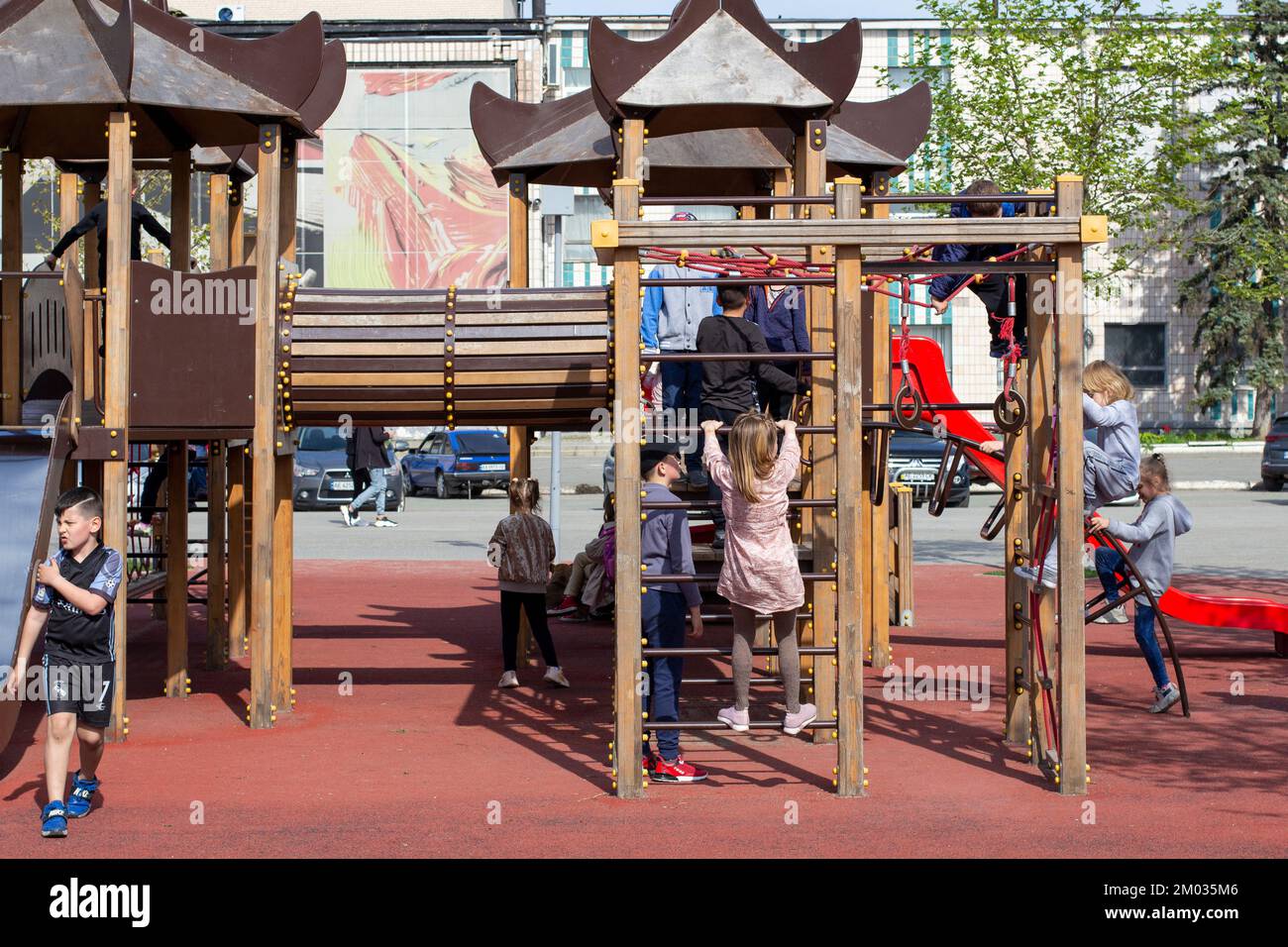 Children playing in playground Stock Photo - Alamy