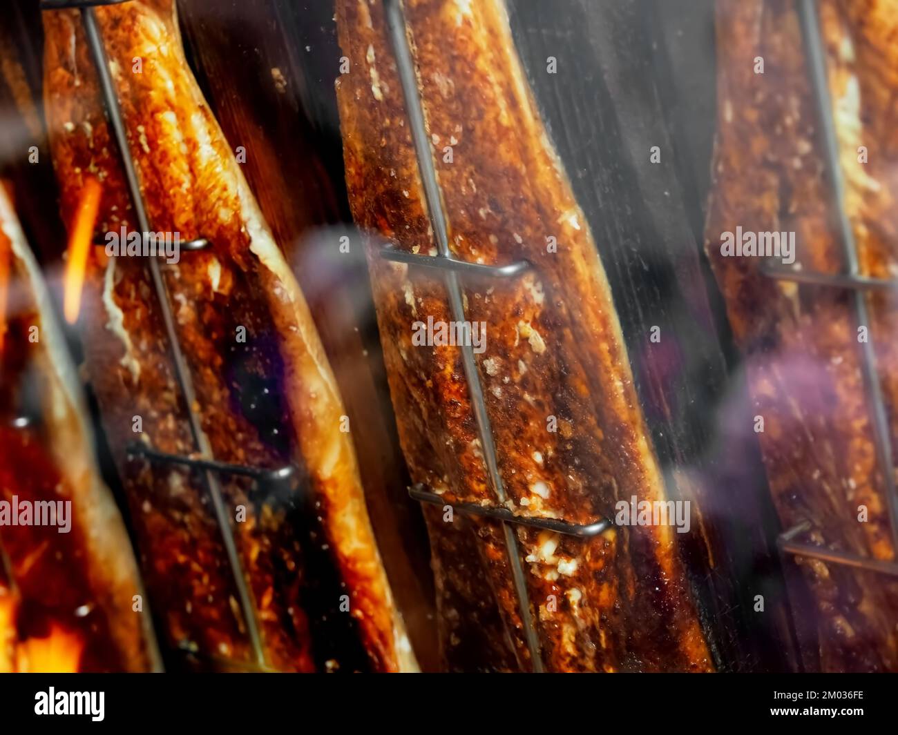 Grilling salmon on fish grill hi-res stock photography and images - Alamy