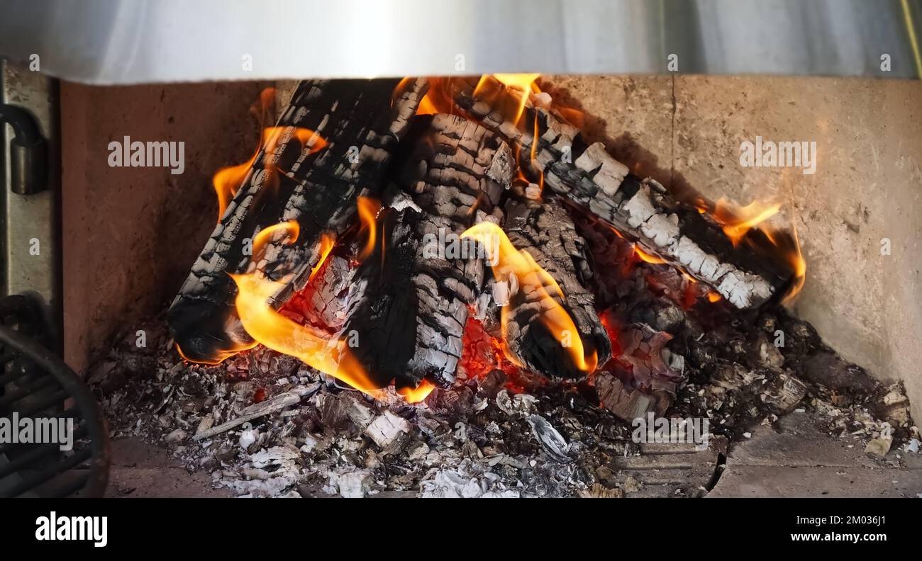 Burning camping fire with flames Stock Photo - Alamy