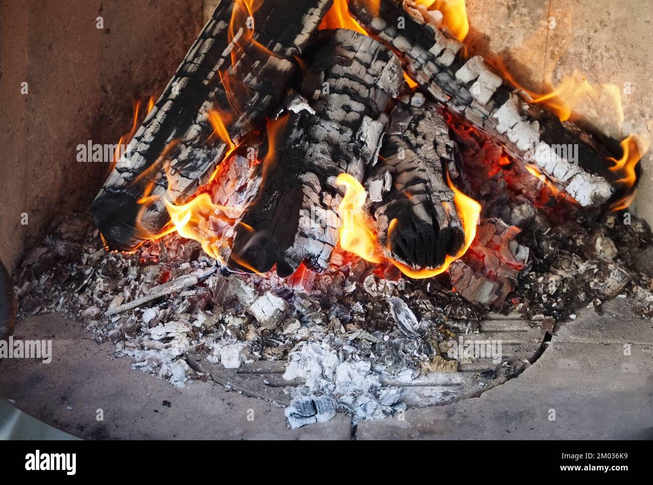 Burning camping fire with flames Stock Photo - Alamy