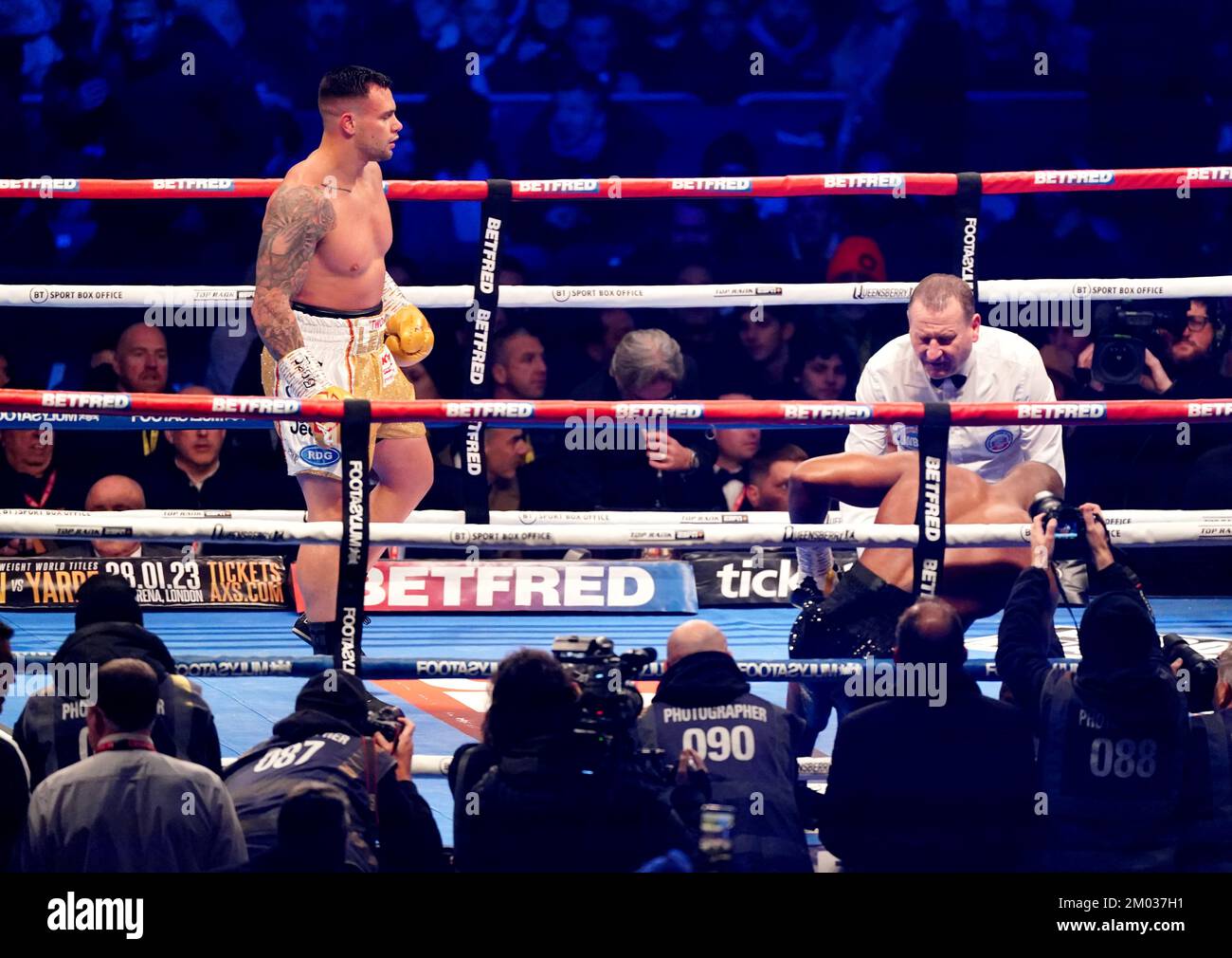 Daniel Dubois (right) goes down during his WBA World Heavyweight title ...
