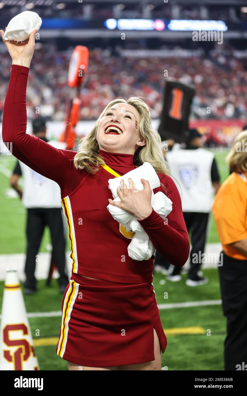 Las Vegas, NV, USA. 2nd Dec, 2022. A USC Trojans cheerleader prepares to give out t-shirts prior ...