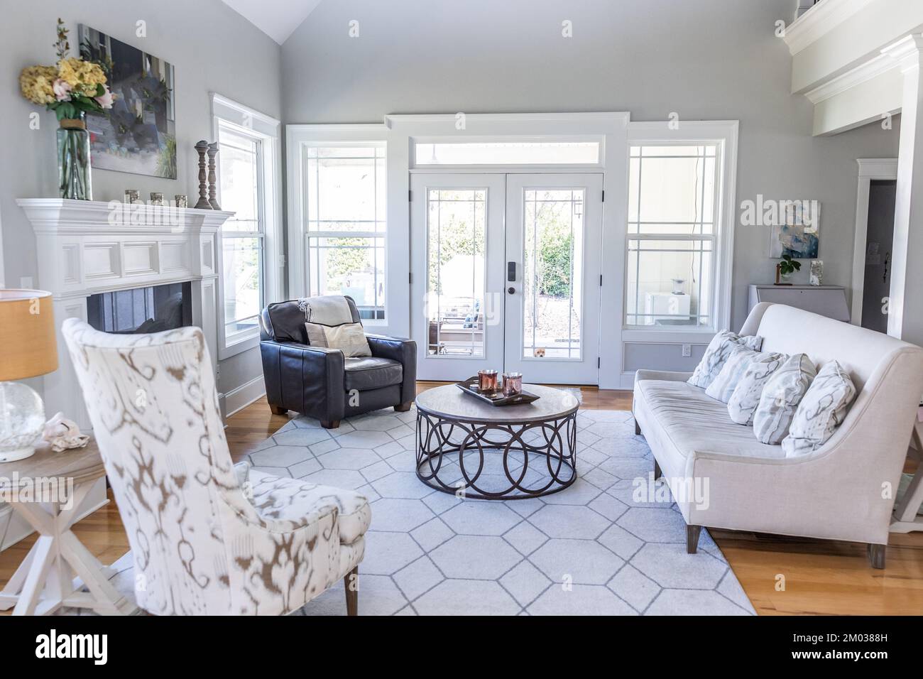 A light and bright open concept living room den with vaulted ceilings ...