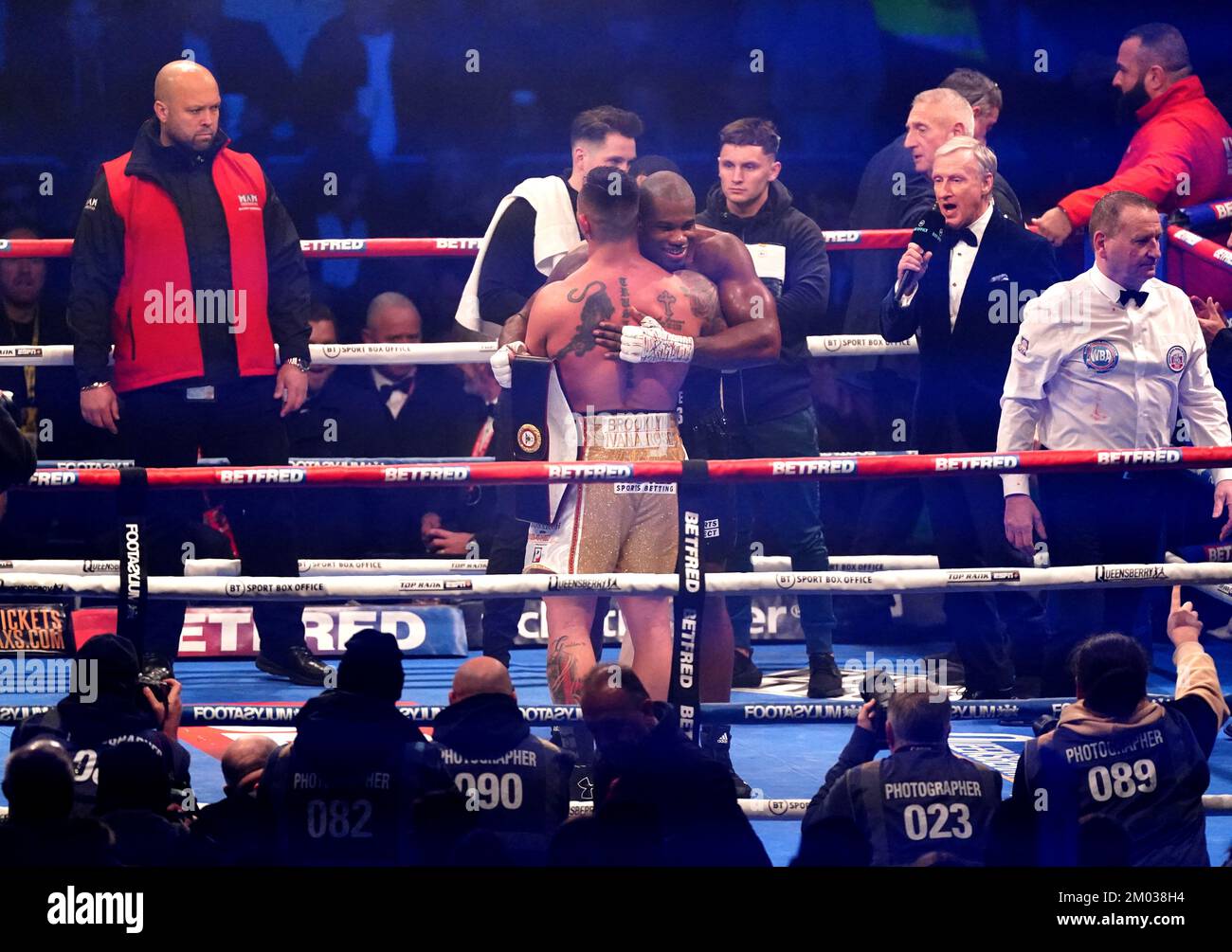 Daniel Dubois (centre right) hugs Kevin Lerena after beating him to win ...