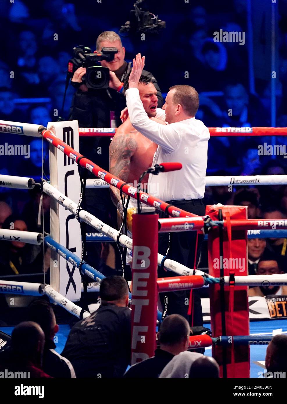 The referee holds onto Kevin Lerena as he calls the WBA World ...