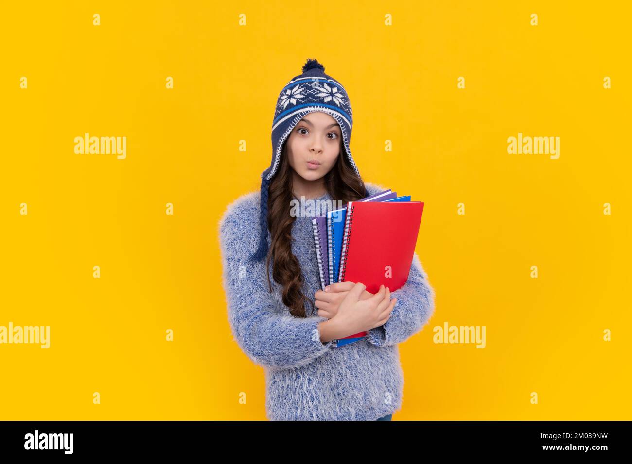 School children in winter hat and sweater with school books on isolated ...