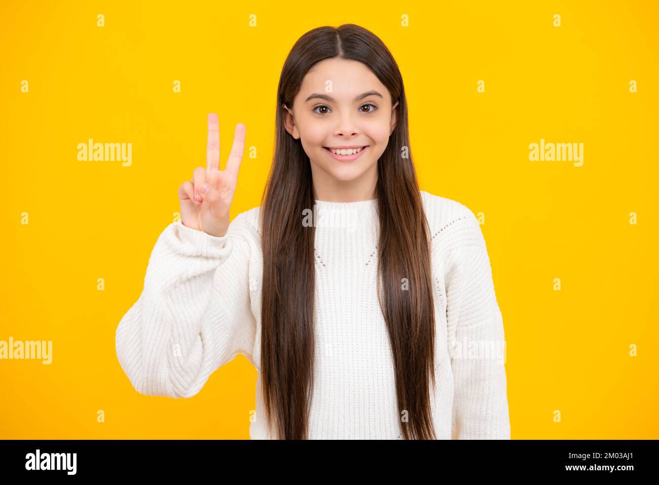 Teenager child girl showing fingers victory sign. Number two, v-sign ...