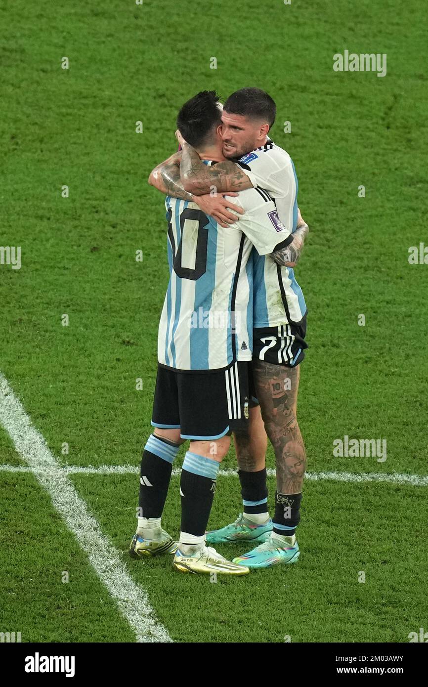Argentina's Lionel Messi (left) and Rodrigo de Paul hug after the final ...