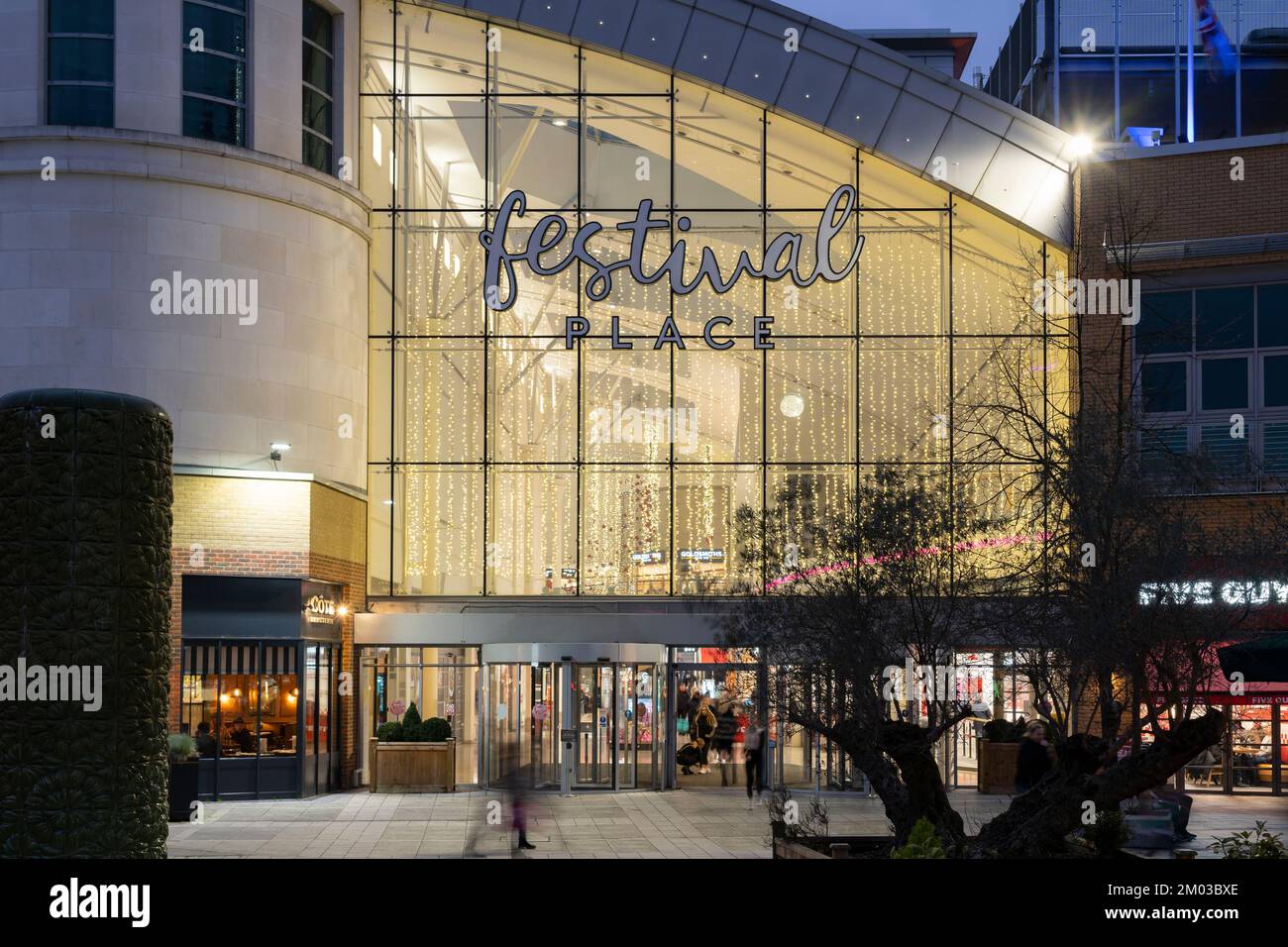 Christmas celebrations and people in Festival Place shopping centre ...