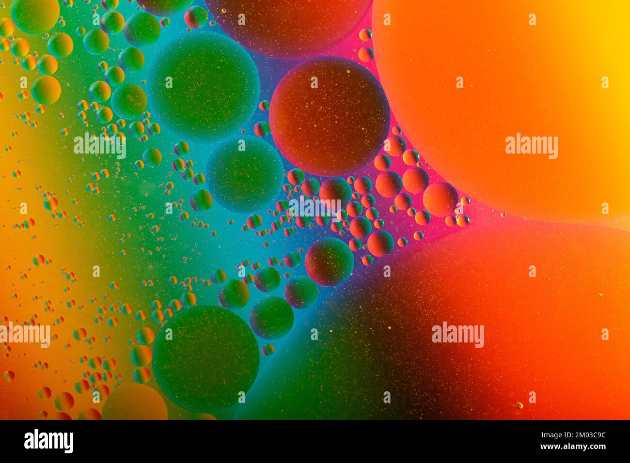 Macro photography of the oil drops on the water surface.Cosmic circles ...