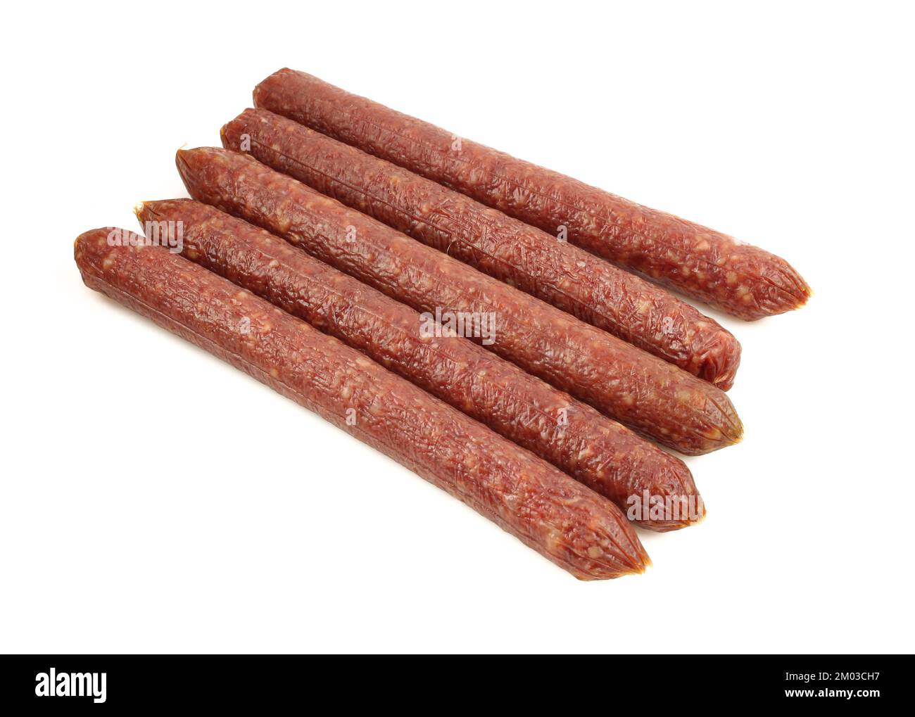 Portion of thin smoked meat sticks isolated on white background Stock ...