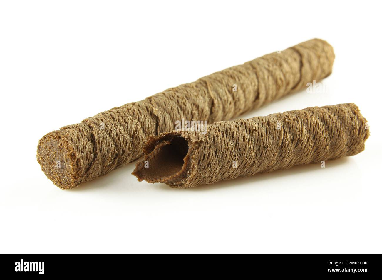 Whole and broken crispy wafer roll sticks filled with chocolate cream ...