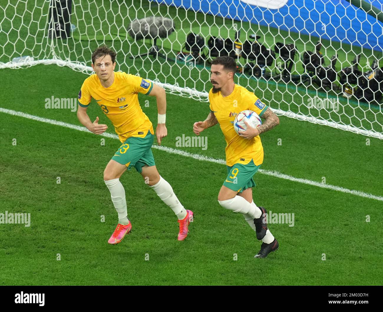Australia's Craig Goodwin (left) celebrates scoring their side's first ...