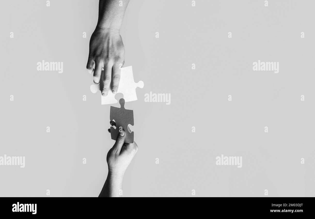 Closeup hands of man connecting jigsaw puzzle. Business solutions ...