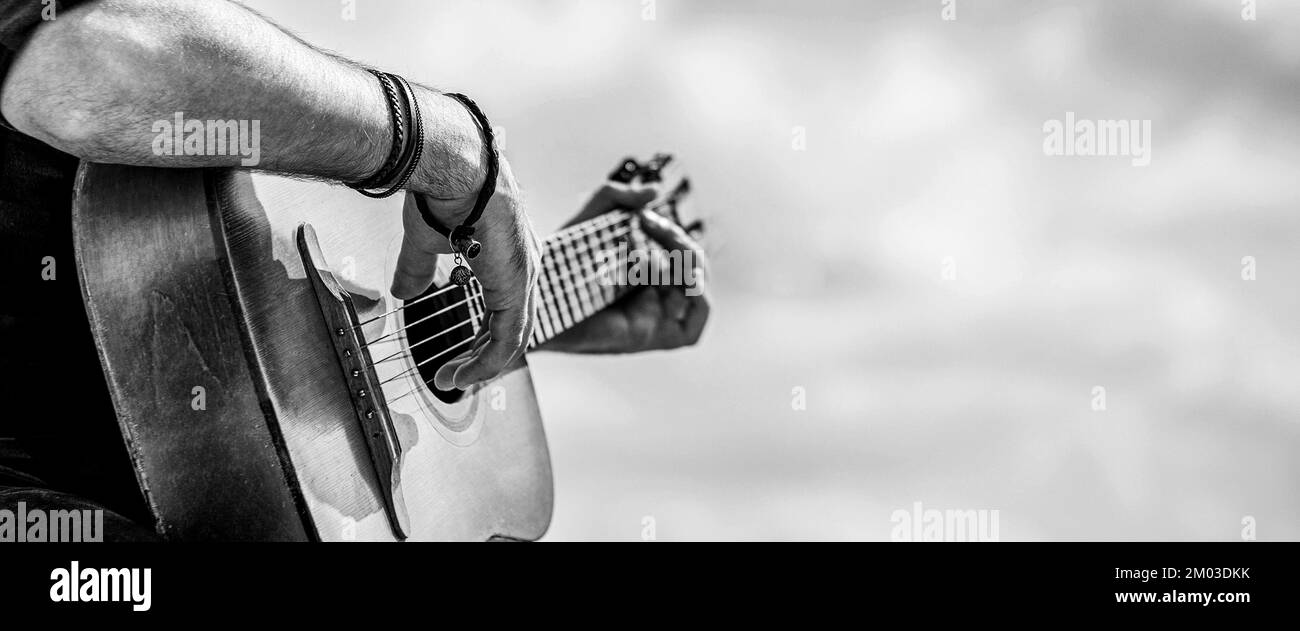 Acoustic Guitars Playing Music Concept Black And White Male Musician Playing Guitar Music