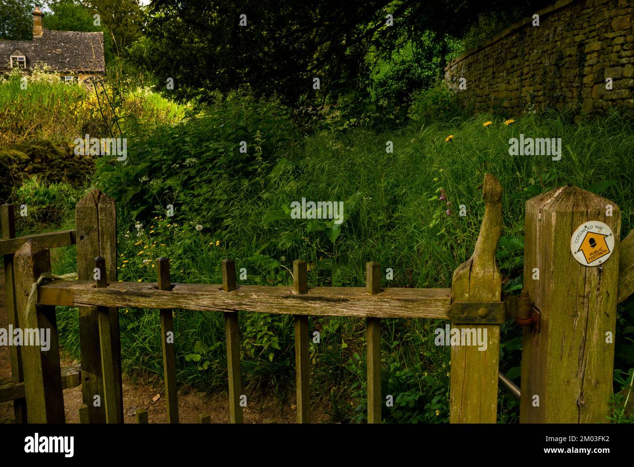 Cotswold Way Public Footpath pass through wooden gates in rural England ...