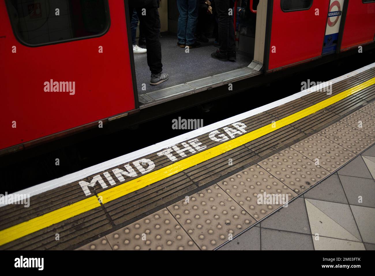 Mind the gap sign, on the London Underground. Warning sign on platform ...