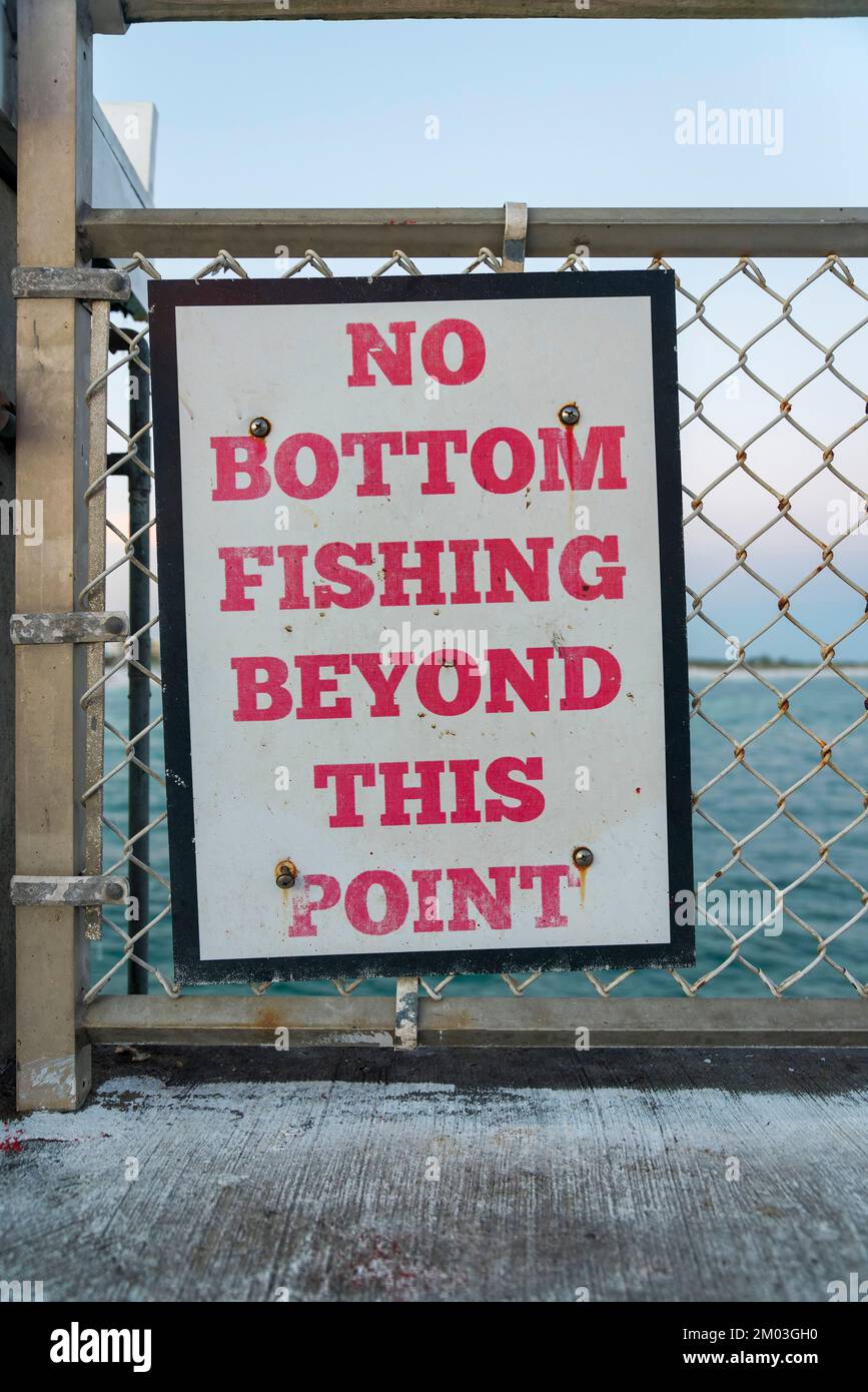 Destin, Florida- No Bottom Fishing Beyond This Point signage on a chain ...