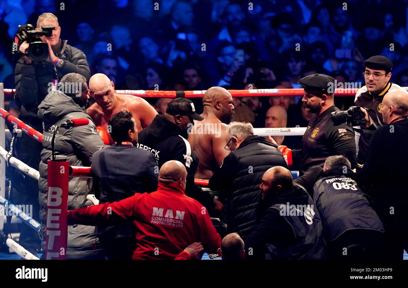 Tyson Fury speaks to a member of Derek Chisora's team after beating ...