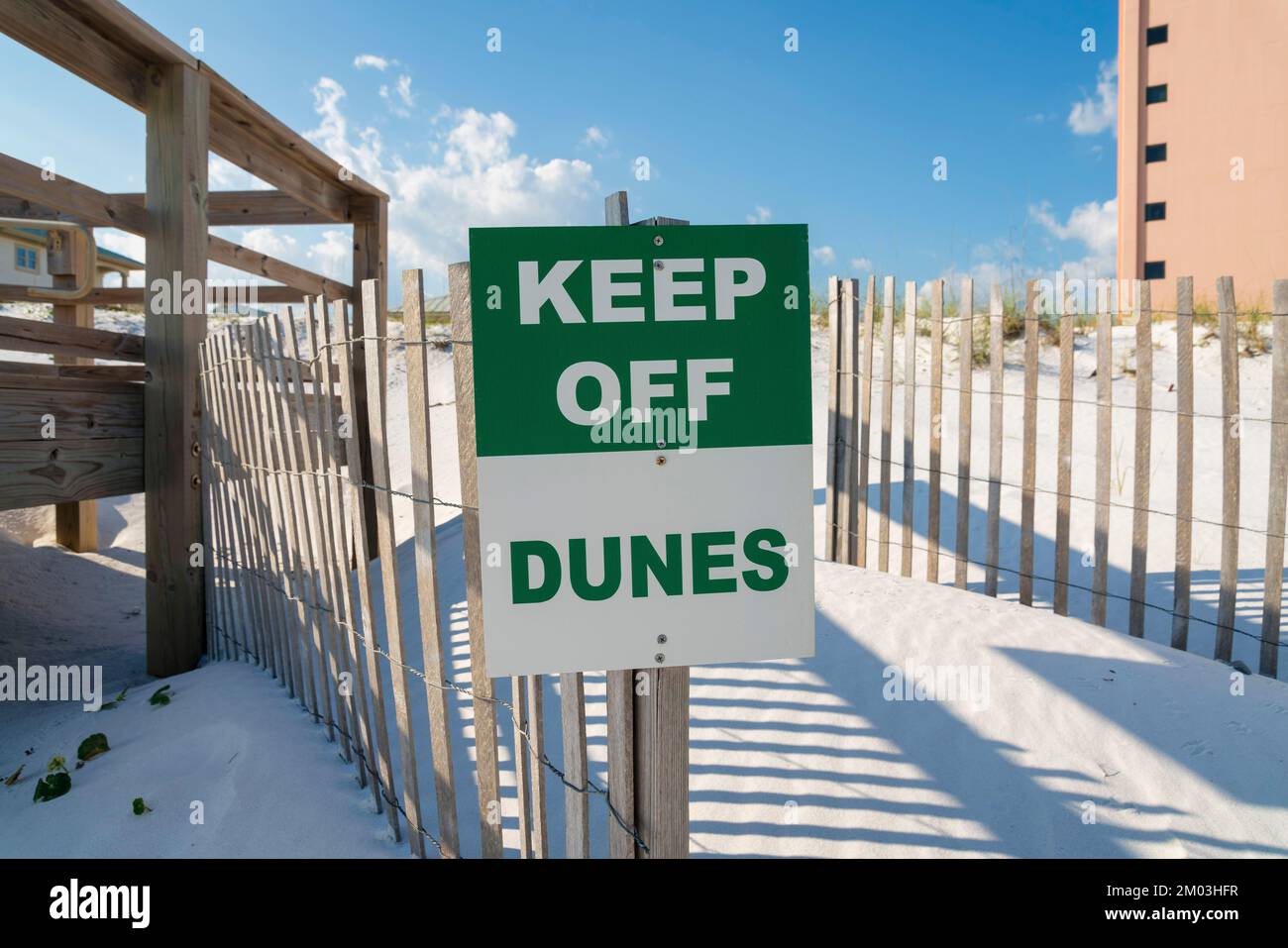 Destin, Florida- Keep Off Dunes sign on a fence panel with wood planks ...