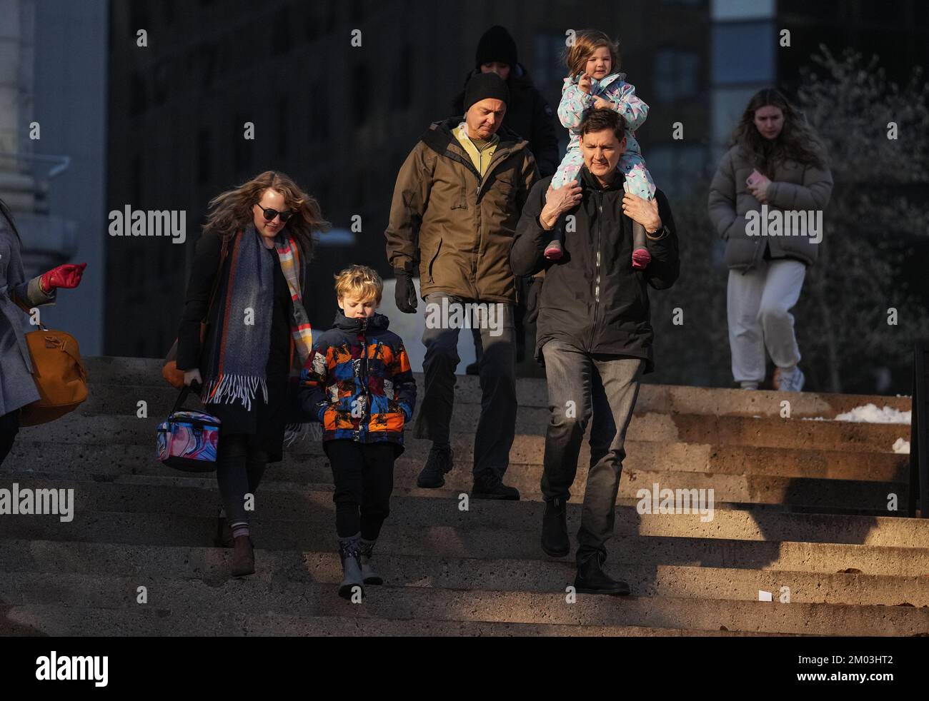 B.C. Premier David Eby carries his daughter Iva, 3, on his shoulders as ...