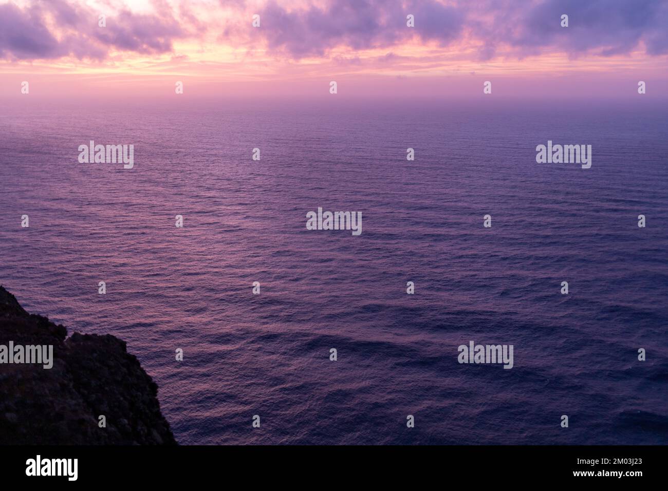Cloudy sky over ocean sunset hi-res stock photography and images - Alamy