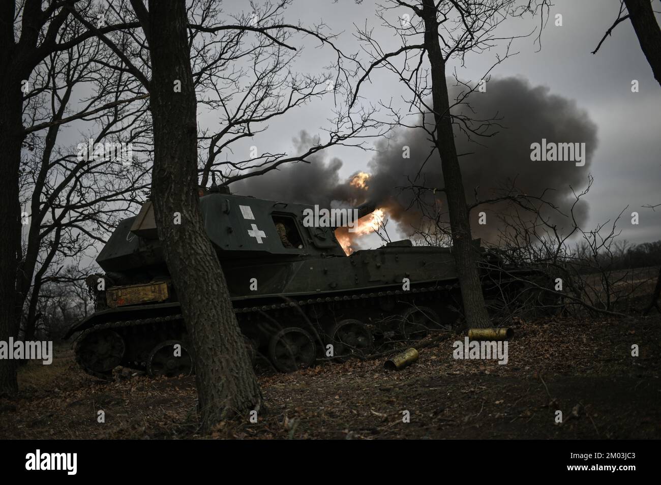 A Ukrainian 2S3 "Akatsiya" self-propelled artillery system fires a 152 ...
