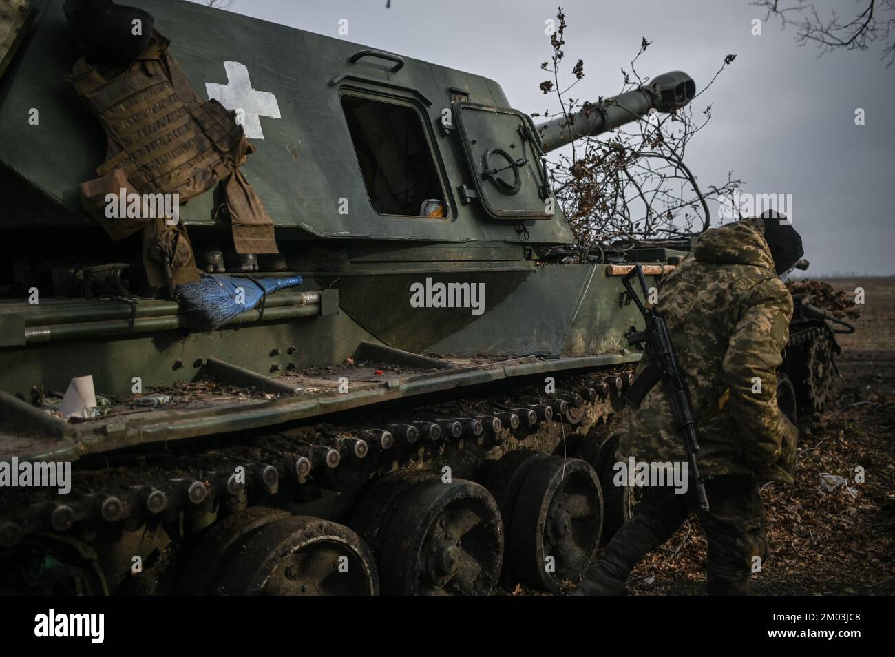 A Ukrainian servicemember disembarks from a 2S3 Akatsiya self-propelled ...