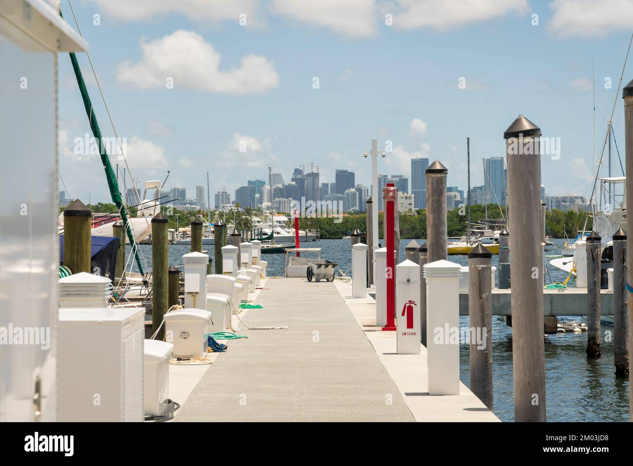 Marina docks with boxes on the side at the bay in Miami, Florida. There ...