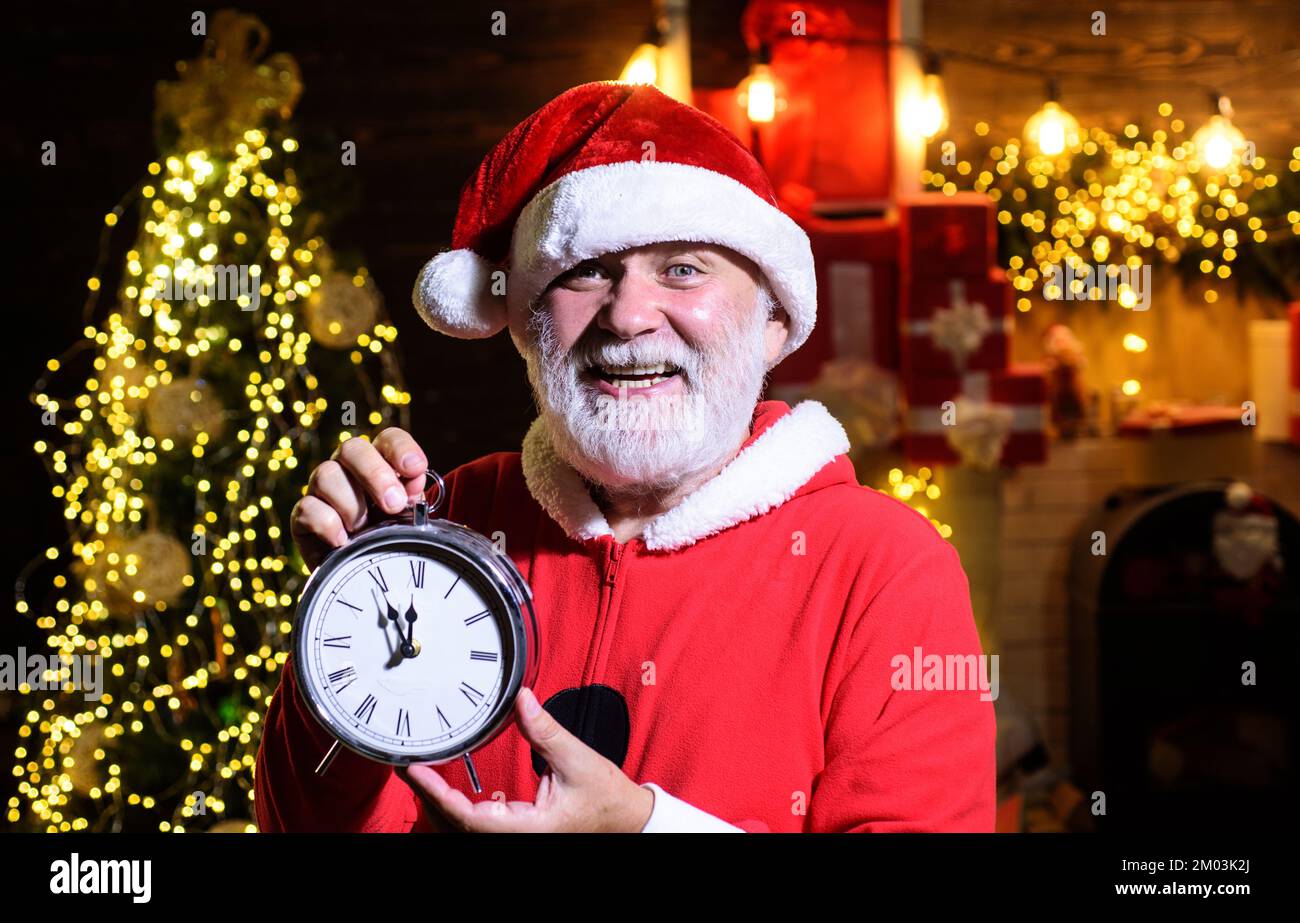 Santa Claus with alarm clock. Christmas time. Happy New Year ...